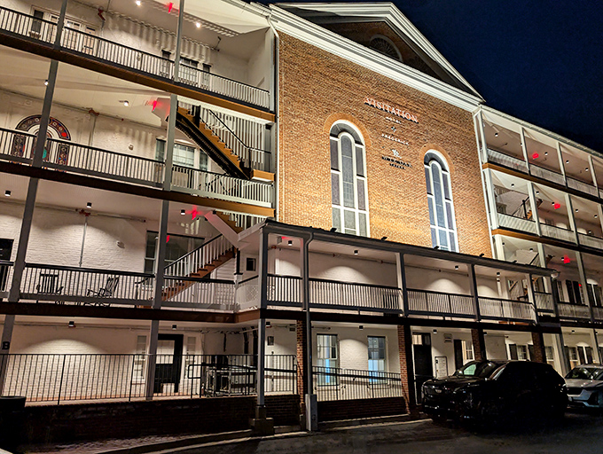 The historic brick fa&ccedil;ade of Wye Oak Tavern glows with promise at night, its multi-level balconies inviting you to step into Frederick's culinary gem.