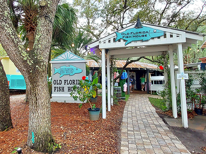 The turquoise-trimmed entrance beckons like a siren song, promising seafood treasures under the shade of Florida oaks. A beach vacation for your taste buds awaits.
