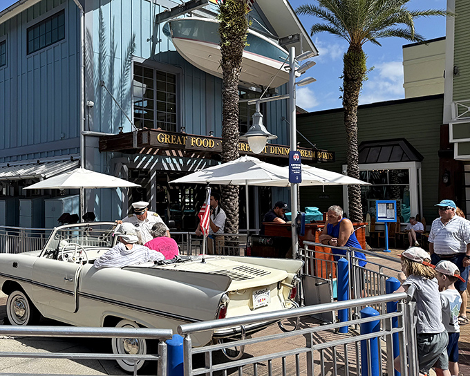 The nautical dream comes to life at The Boathouse's striking exterior, where vintage boats and Florida sunshine create the perfect prelude to seafood paradise.