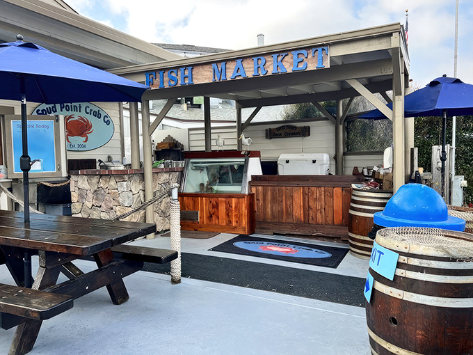The unassuming exterior of Spud Point Crab Company proves once again that the best seafood often comes from places where boats outnumber parking spots.