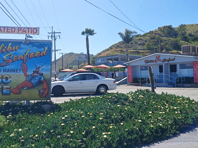 The unassuming white exterior of Malibu Seafood belies the culinary treasures within—where ocean views and fresh catches create California coastal magic.