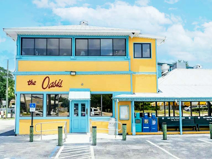 The bright yellow exterior with turquoise trim isn't trying to be subtle &ndash; it's shouting "Fresh seafood here!" like a friendly fishmonger at dawn.