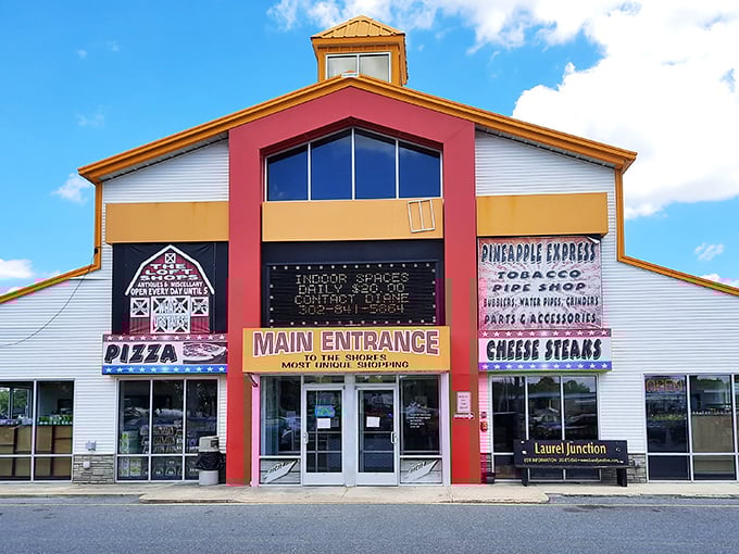 The vibrant red and yellow facade of Laurel Junction beckons like a carnival barker promising treasures within. Delaware's bargain-hunting paradise awaits!