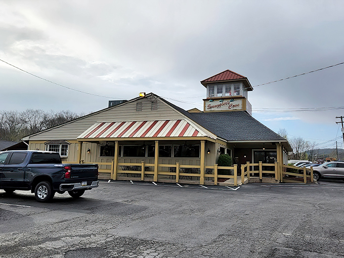 The coastal charm of Smuggler's Cove stands proudly in Tannersville, complete with its distinctive tower and welcoming wooden deck. A New England escape in Pennsylvania's mountain landscape.