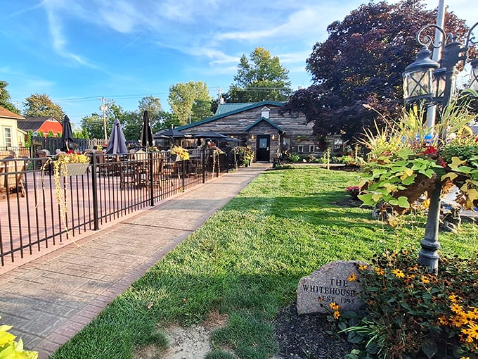 The rustic log exterior of Whitehouse Inn welcomes you like an old friend, complete with a charming patio that practically begs you to linger.