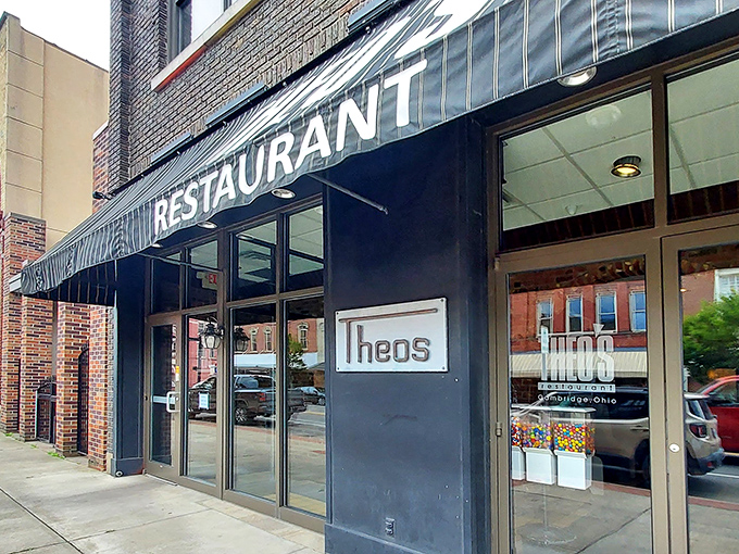 The classic black awning of Theo's Restaurant stands as a beacon of culinary comfort in downtown Cambridge, promising honest food without pretension.