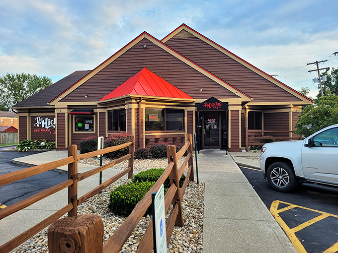 The Hickory House's distinctive brown exterior with its bright red roof stands like a beacon of comfort food promise in Reynoldsburg.