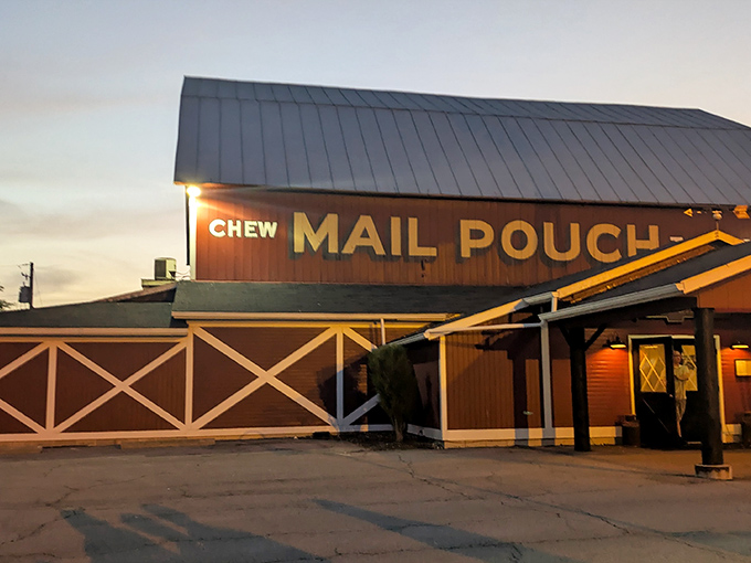 The iconic red barn exterior with its Mail Pouch Tobacco sign and spinning windmill isn't just Instagram-worthy&mdash;it's a promise of authentic Midwestern flavor waiting inside.