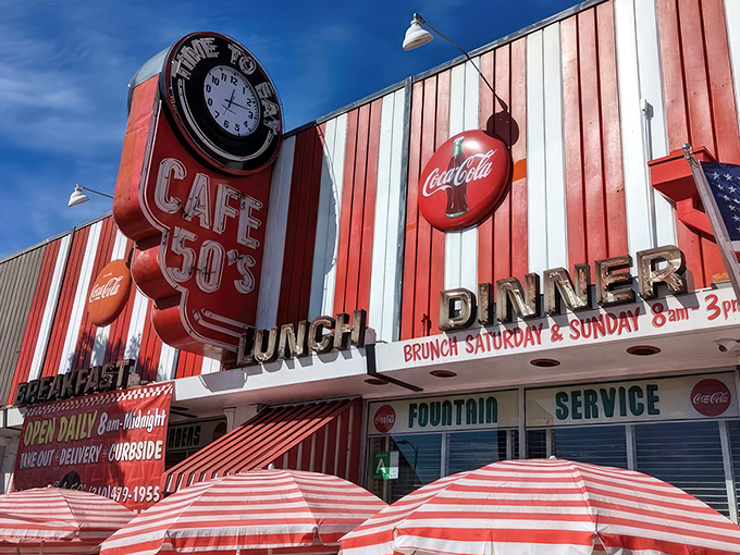 The time machine disguised as a diner. Cafe 50's vibrant red and white striped exterior beckons with promises of nostalgic delights and all-day breakfast.