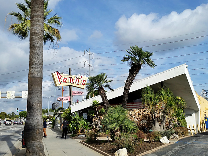 The iconic angular roof of Pann's slices through the LA sky like a mid-century dream. Classic Googie architecture at its finest, complete with that unmistakable neon sign.