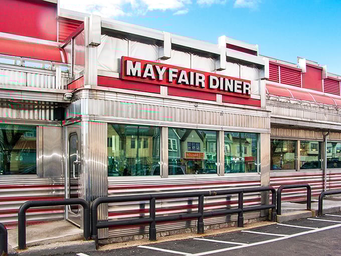The iconic Mayfair Diner sign stands tall against the Philadelphia sky, a beacon of comfort food that's been calling hungry patrons home for generations.