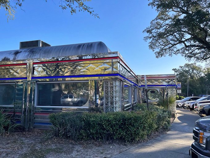 Chrome and nostalgia shine at Scenic 90 Cafe's exterior, a time capsule of Americana gleaming in the Florida sunshine like a vintage postcard come to life.
