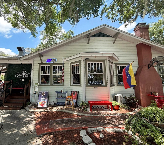 A charming white cottage with vibrant red outdoor seating, Susana's Cafe looks like it was plucked from a storybook and dropped under Florida's magnificent oak trees.