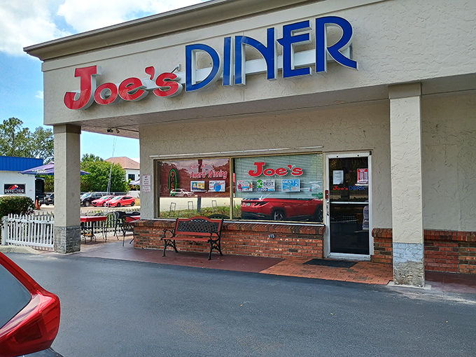 The classic red and blue signage of Joe's Diner beckons like an old friend promising comfort food and conversation in equal measure.
