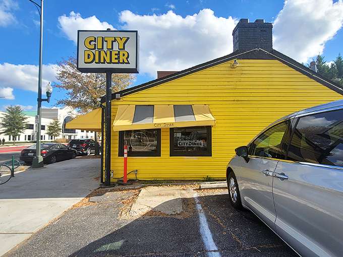 The sunshine-yellow exterior of City Diner stands like a beacon of breakfast hope on Broad Street, promising comfort food salvation to hungry Richmonders.