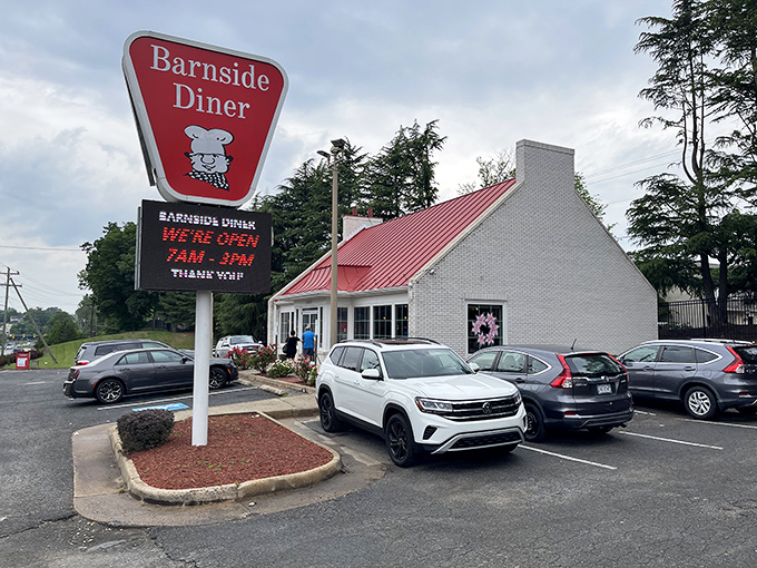 The iconic red roof of Barnside Diner beckons hungry travelers like a lighthouse guiding ships to breakfast harbor. Classic Americana at its finest.