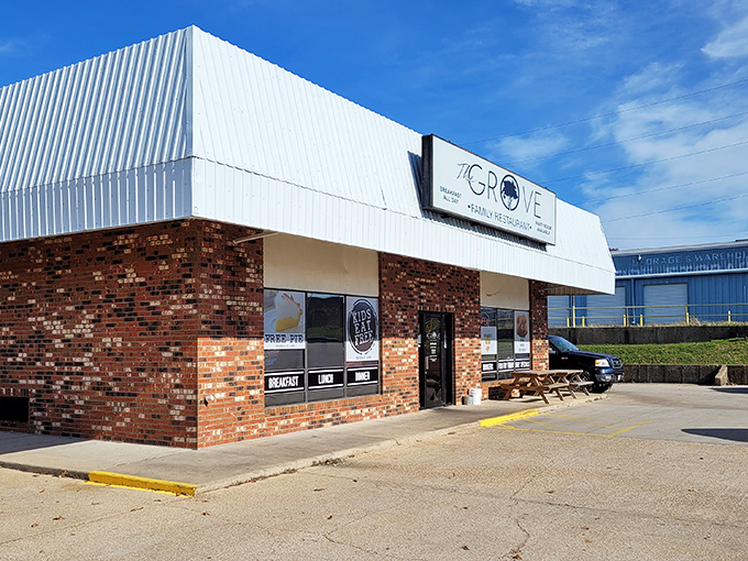 The unassuming brick facade of The Grove Family Restaurant hides culinary treasures within. That "FREE PIE" sign isn't just decoration&mdash;it's a promise of sweet things to come.