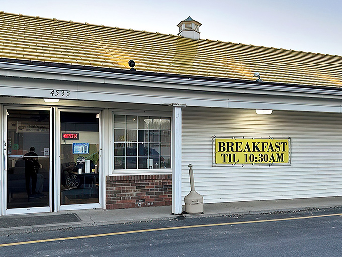 Bold white lettering against classic siding proudly declares what locals already know &ndash; this modest building houses chicken perfection worth crossing roads for.