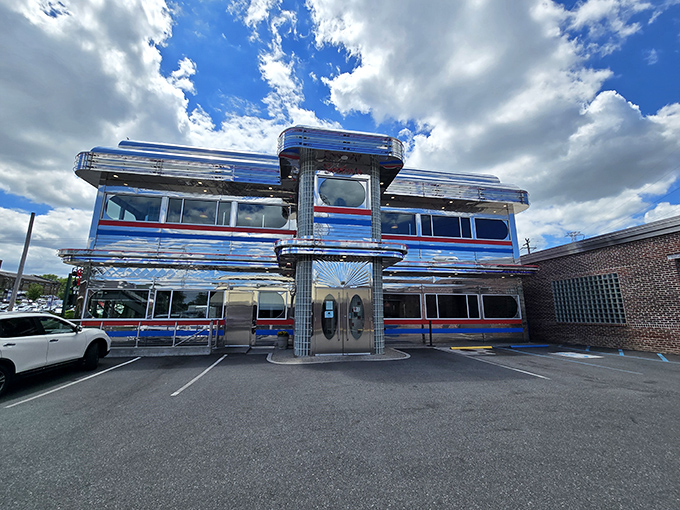 The gleaming chrome exterior of Goobers Diner shines like a time machine to the 1950s, complete with classic red and blue racing stripes.