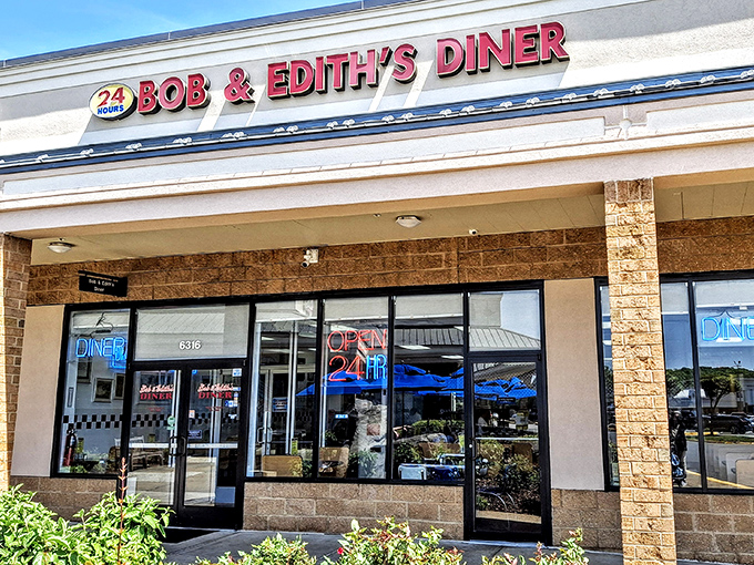 The glowing "OPEN 24 HR" sign isn't just illumination&mdash;it's a beacon of hope for night owls and early birds alike at Bob & Edith's Diner.