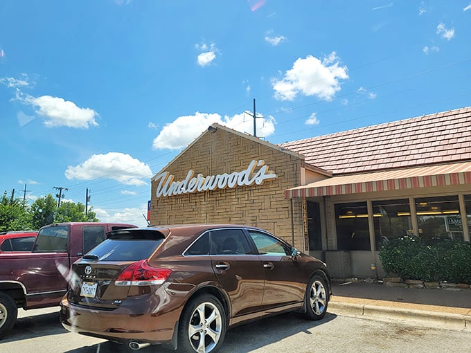 The limestone facade of Underwood's stands like a beacon of culinary promise under the vast Texas sky. Some buildings just whisper "good food happens here."