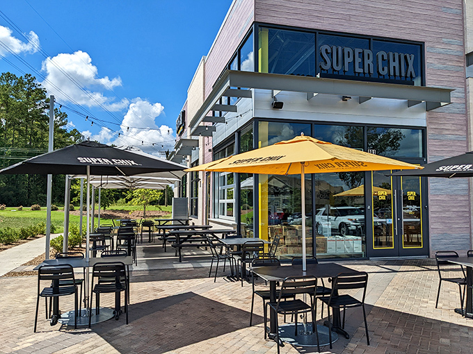 Modern meets mouthwatering at Super Chix's Fort Mill location, where those bright yellow umbrellas practically scream "chicken paradise awaits inside!"