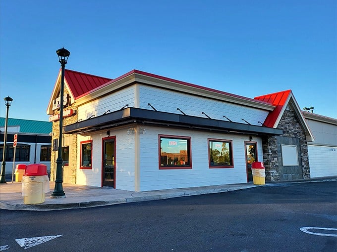 The iconic red-roofed Lee's Famous Recipe Chicken stands like a beacon of comfort food promise, beckoning hungry Virginians with its no-nonsense charm.