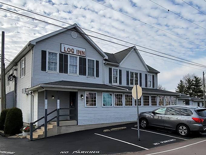 The unassuming exterior of The Log Inn belies the culinary treasures within. This historic Haubstadt landmark has been satisfying Hoosier appetites for generations.