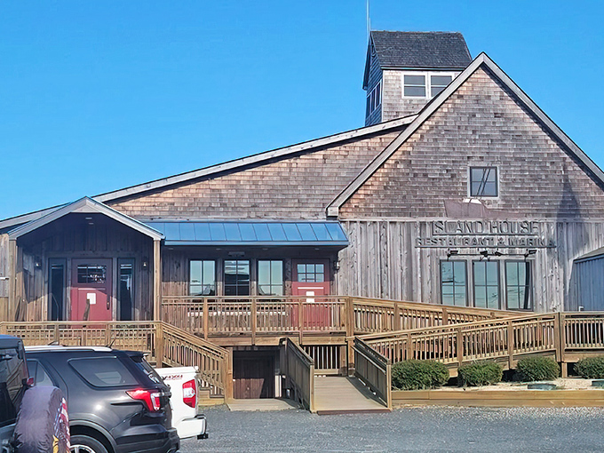 The weathered shingles and rustic charm of Trident Tackle tell stories of countless fishing adventures before memorable meals at Island House.