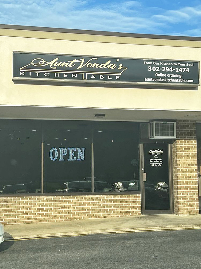 The welcoming counter at Aunt Vonda's features a stunning black wall with golden script that promises to feed both body and soul.