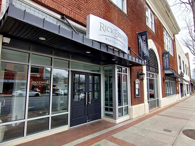 The elegant silver signage against classic brick announces Rick Erwin's West End Grille like a beacon for hungry Greenville locals seeking culinary salvation.