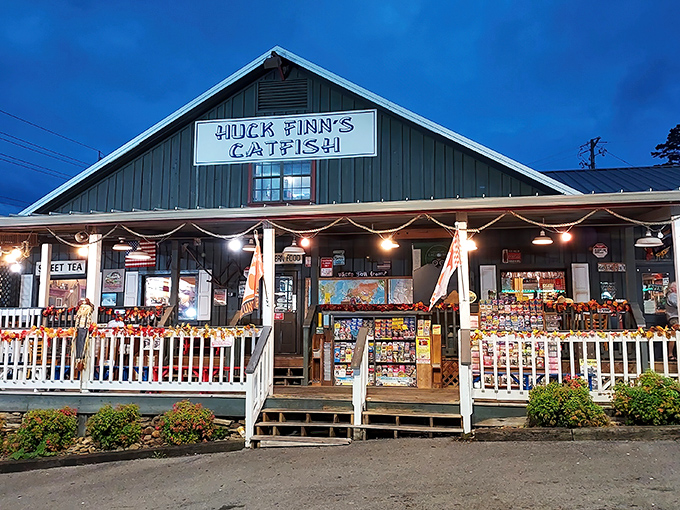 The unassuming green-roofed exterior of Huck Finn's Catfish stands as a beacon of Southern comfort amid Pigeon Forge's flashier attractions. Sometimes the best treasures don't need neon signs.