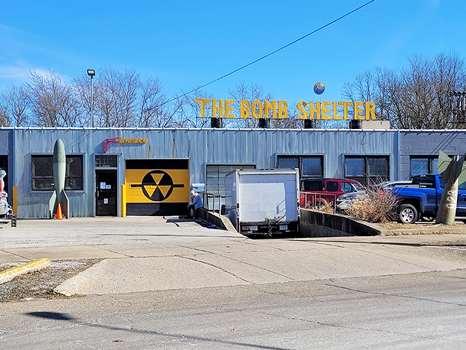 The unassuming exterior hides a universe of nostalgia behind that bright yellow nuclear symbol. Like finding a portal to the past in suburban Akron. 