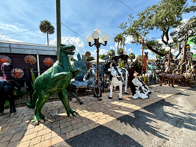 A whimsical wonderland where metal palm trees and pink flamingos hold court over an empire of garden treasures waiting to find their forever homes.