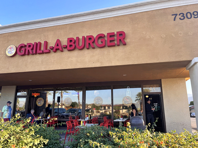 The unassuming exterior of Grill-A-Burger stands like a culinary mirage in the Palm Desert heat, promising delicious relief to hungry travelers.