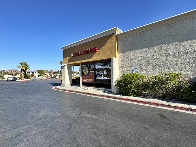 The unassuming exterior of Grill-A-Burger stands like a culinary mirage in the Palm Desert heat, promising delicious relief to hungry travelers.