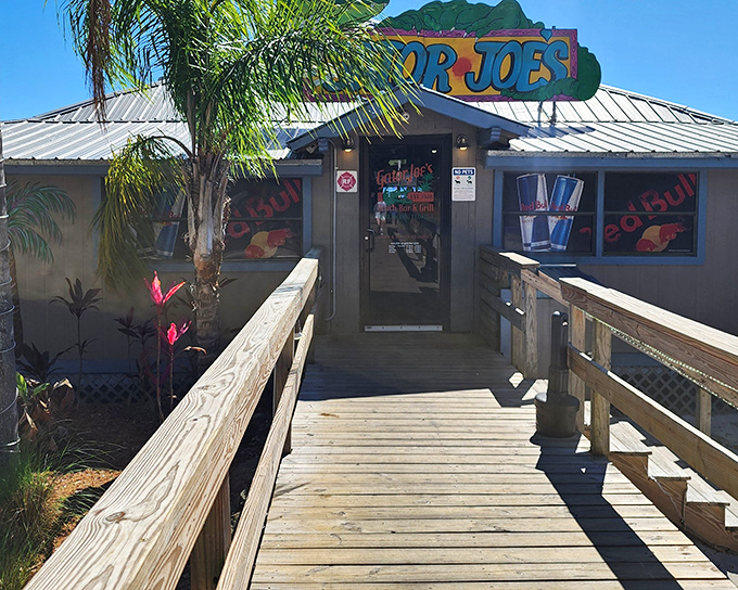 The wooden walkway to flavor paradise. Gator Joe's unassuming entrance promises authentic Florida dining without pretension, just pure lakeside charm.