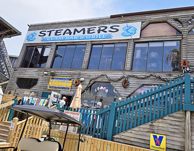 The weathered wooden exterior with bright blue railings isn't trying too hard—it's Florida authenticity that can't be manufactured or franchised.