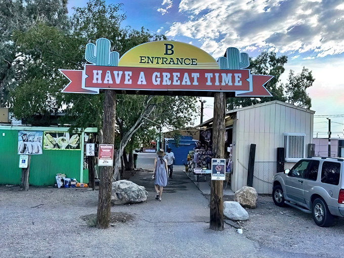 The iconic "HAVE A GREAT TIME" entrance sign promises exactly what awaits beyond&mdash;a desert bazaar where treasure hunting becomes an art form.