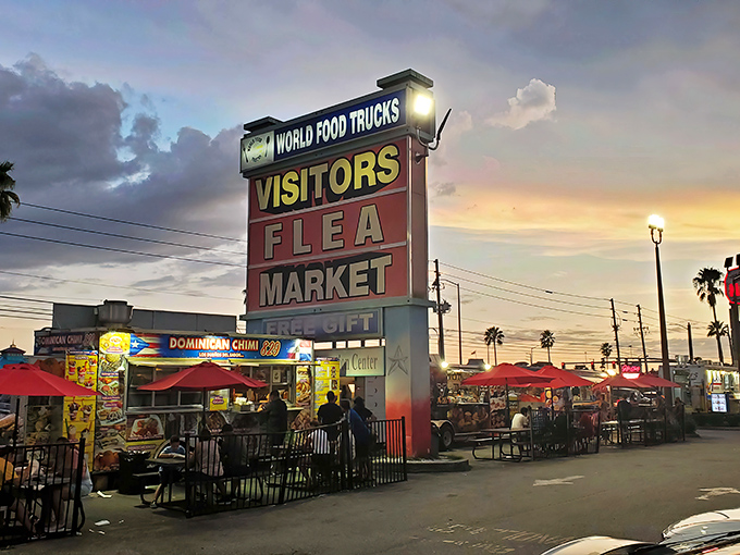 The iconic sign glows against a Florida sunset, promising treasures and treats within. Like a carnival for bargain hunters, the food trucks beckon with delicious aromas.