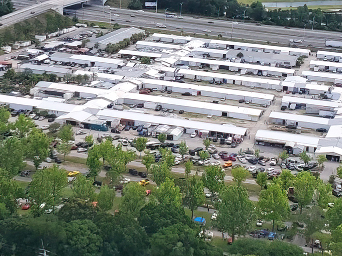 From above, the Daytona Flea & Farmers Market resembles a small city dedicated to bargain hunting, with rows of white-roofed buildings stretching across acres of shopping paradise.