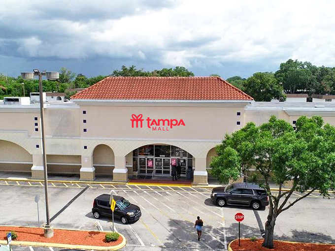 The Spanish-style roof and bold red signage of Tampa Mall beckons bargain hunters like a lighthouse for the fiscally responsible.