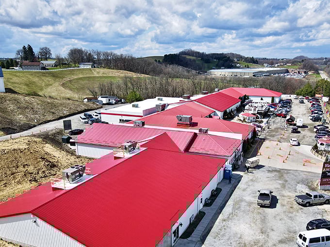 The iconic red roof of Walnut Creek Marketplace stands out against Ohio's rolling hills like a beacon for treasure hunters and bargain lovers alike.