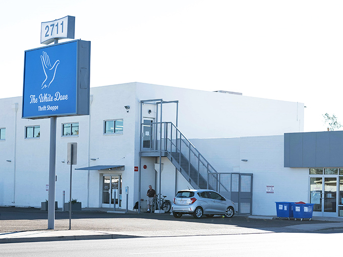 The iconic blue sign beckons bargain hunters like a retail lighthouse, promising treasures within that won't break the bank.