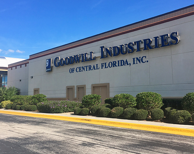 The unassuming exterior of Goodwill Industries of Central Florida belies the treasure trove waiting inside. Florida palm trees stand guard over this bargain hunter's paradise.