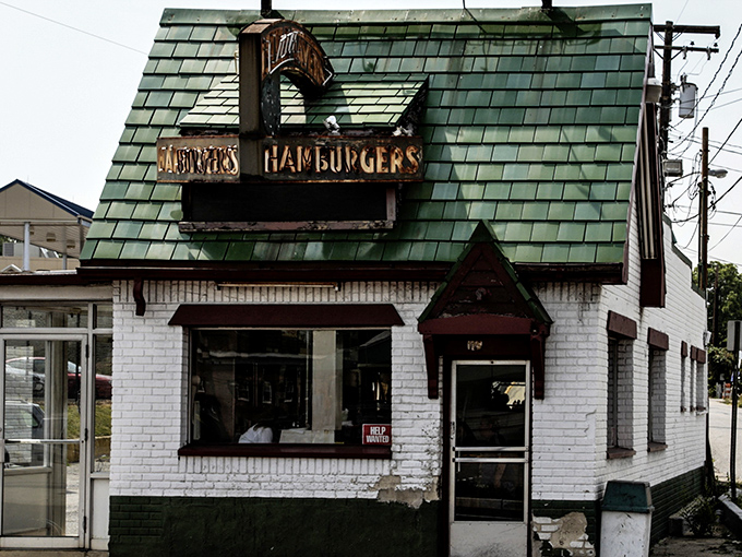 The iconic green-shingled roof and weathered "DONUTS HAMBURGERS" sign announce this Laurel institution without fanfare&mdash;architectural honesty at its most delicious.