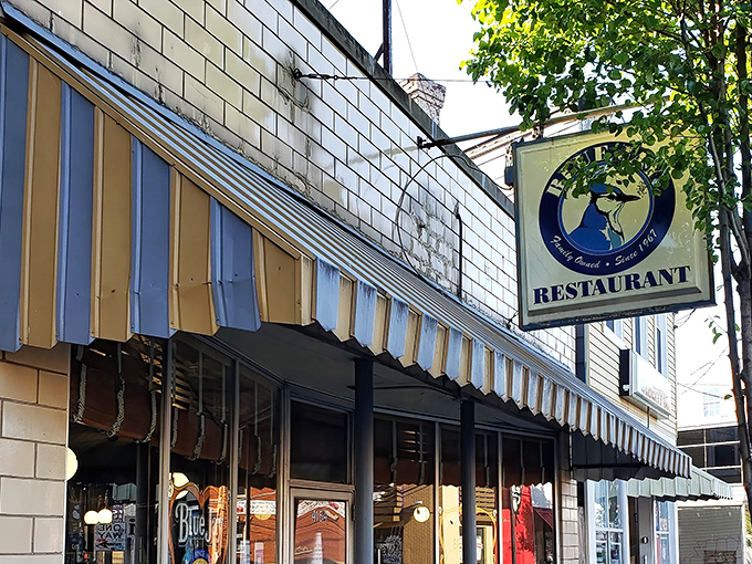 The Blue Jay's iconic striped awning and golden "50 years" balloons aren't just decoration&mdash;they're a promise of Cincinnati breakfast history that's stood the test of time.