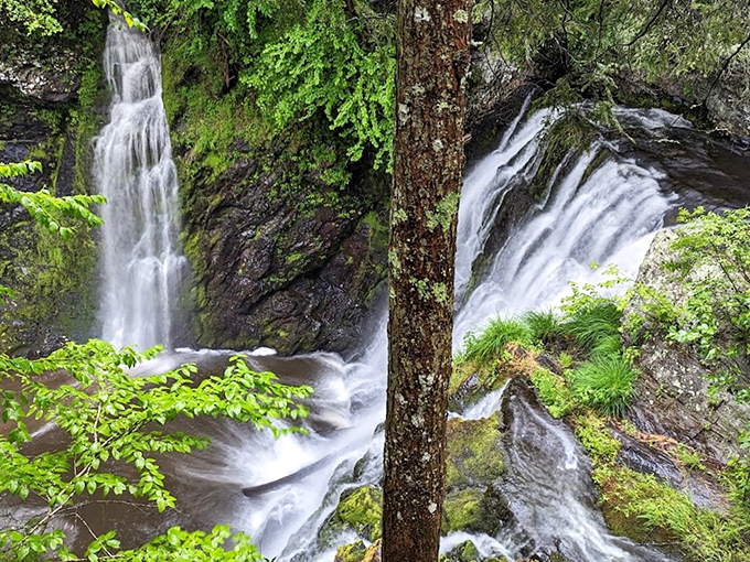 Nature's three-tiered masterpiece puts on a spectacular show, with rushing water carving through ancient rock formations in Pennsylvania's hidden gem.