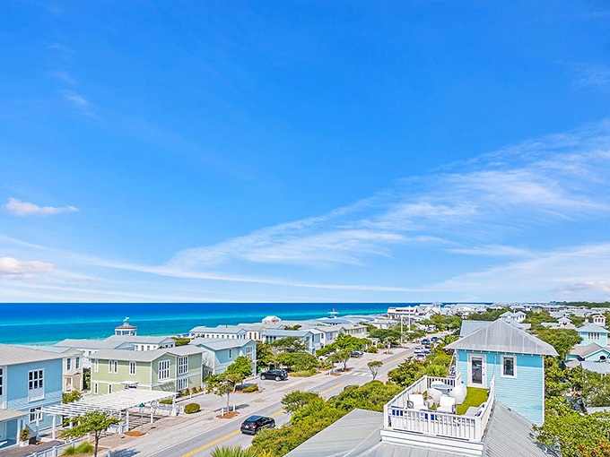 Pastel perfection meets coastal charm in Seaside's iconic architecture. Those metal roofs gleaming in the sunshine are practically begging for a postcard moment.