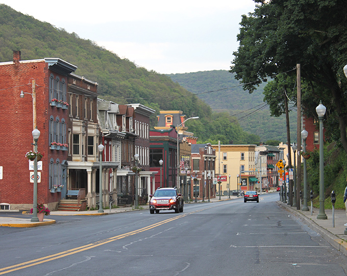Downtown Pottsville stretches before you like a living postcard, where historic brick buildings stand sentinel against the backdrop of Pennsylvania's rolling hills.